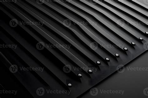 black textured surface with parallel ridges and circular indentations