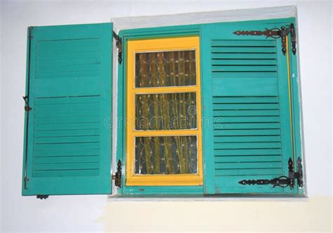 Green Window Shutters With Yellow Window Frames Stock Image Image Of