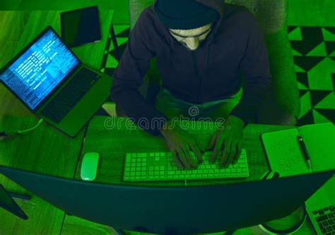 Cybersecurity Crime And Man Programming From Above In Neon Office With Code Fraud And Hacking