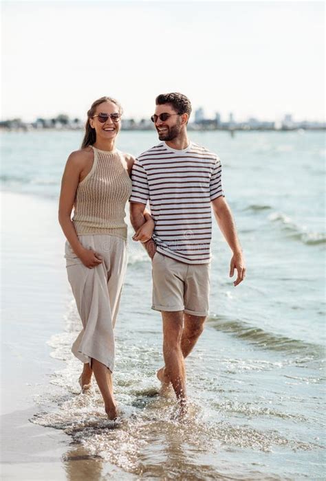 Happy Couple Walking Along Summer Beach Stock Image Image Of