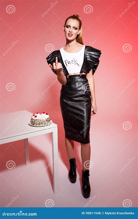 Young Beautiful Brutal Blonde Girl Showing Over Pink Background Stock