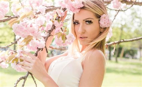 Premium Photo Portrait Of Woman Standing By Tree