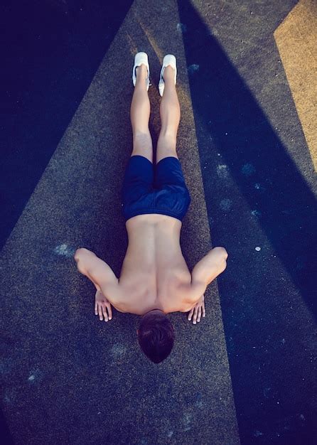 Premium Photo Athletic Man Doing Push Ups Outdoor