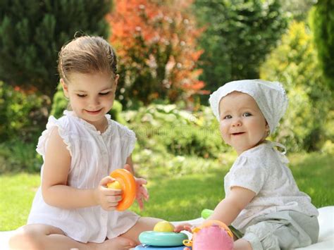 Two Little Sisters In The Summer Garden Stock Image Image Of Green Colorful 23623845