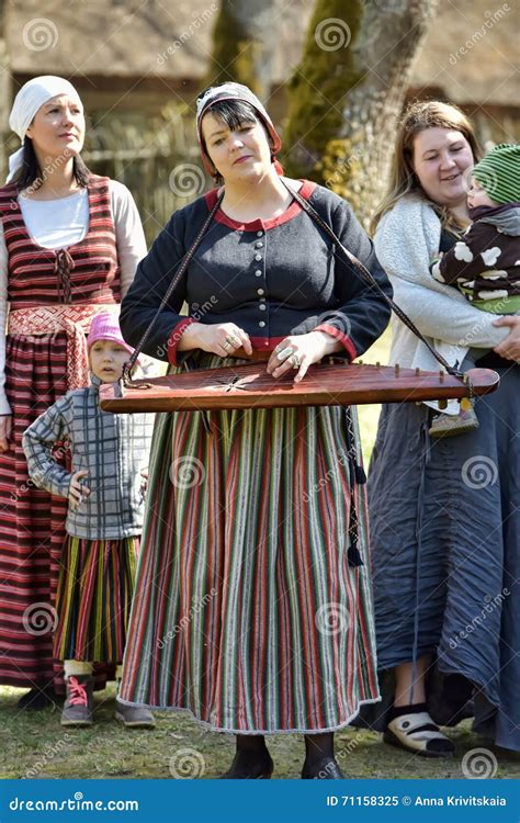 Latvian Woman In National Dress With A Musical Instrument Editorial