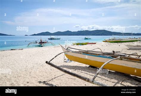 Bangka Fishing Boats On The Beach Of Inapupan Island In The Philippines