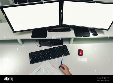 Top View Workspace With Two Blank Screen Monitors Keyboard And Computer Mouse On A Desk Inside