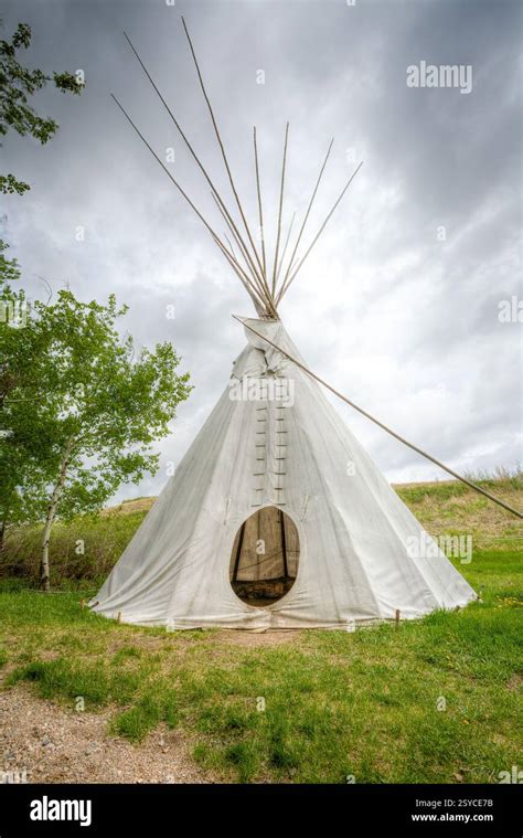 Teepee Is Standing In A Grassy Field The Teepee Is White And Has A