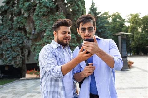 Premium Photo Two Students Help Your Classmate With Navigation