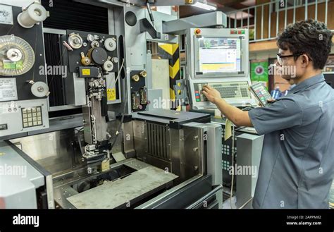 Worker Working With Cnc Machine At Workshop Stock Photo Alamy