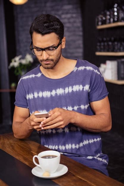 Premium Photo Man Using His Smartphone