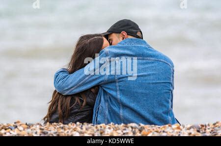 Young Couple Embrace Nude Lovers On Beach Sunset Topless Naturist Stock