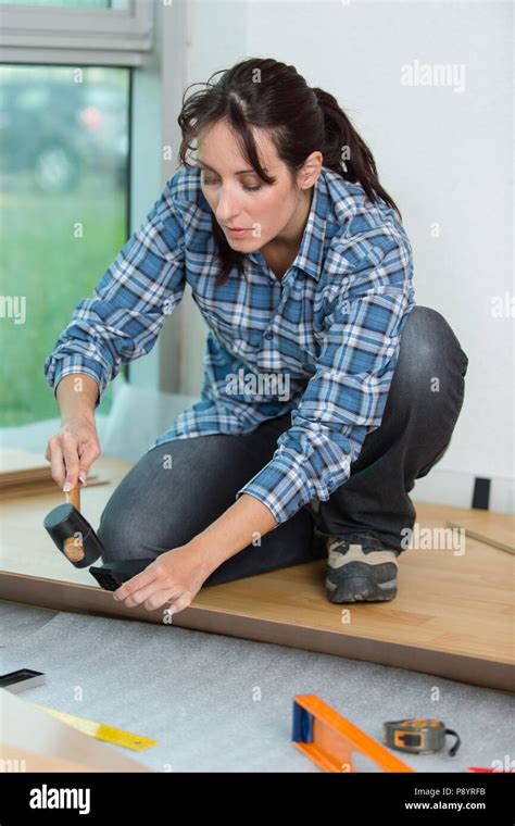 Woman Using A Hammer And Chisel Stock Photo Alamy