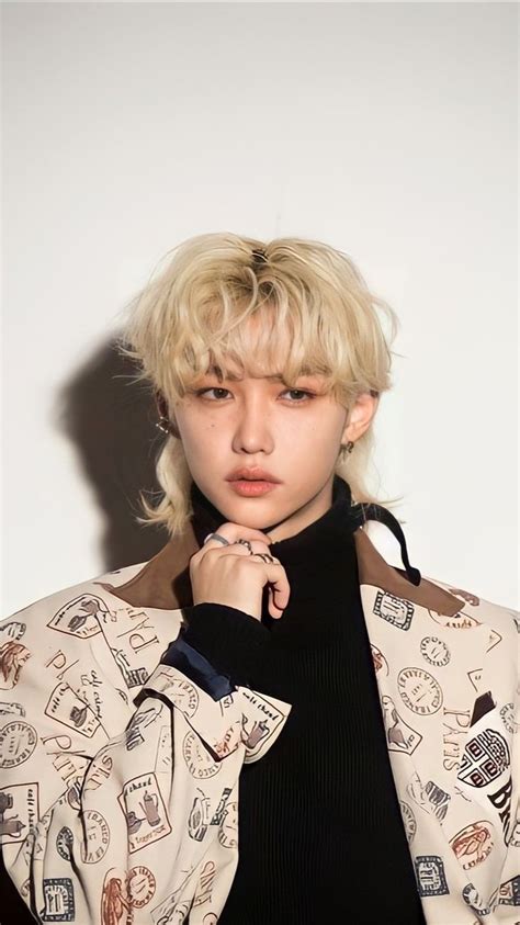 A Woman With Blonde Hair Wearing A Jacket