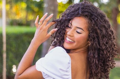 Premium Photo Beautiful Afro Woman With Curly Hair Smiling