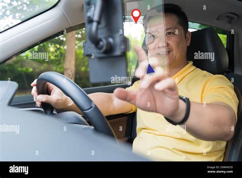 Close Up On A Couple Using The GPS While Driving A Car Driver Using