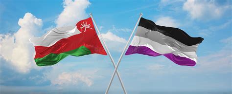 Two Crossed Flags Asexuality Pride And Oman Waving In Wind At Cloudy Sky Concept Of