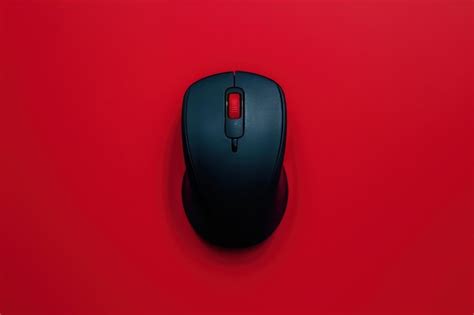 Premium Photo Black Wireless Computer Mouse On Red Background