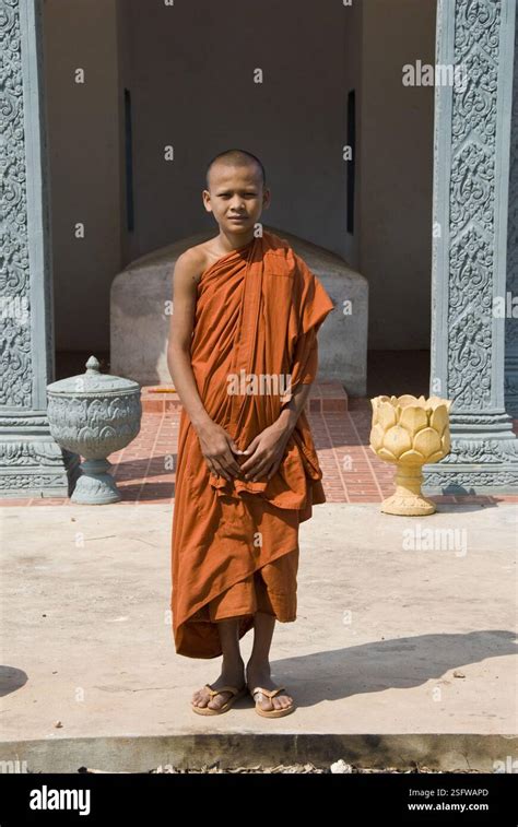 A Young Monk Stands By Ta Moks Grave At A Buddhist Temple In Anlong Veng Ta Mok Was A Senior