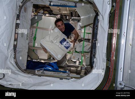 Nasa Astronaut And Expedition 63 Commander Chris Cassidy Unloads A Bag