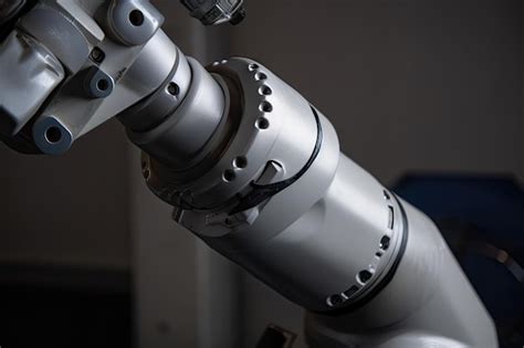 Premium Ai Image Closeup Of Robot Arm Greased And Ready For Use Created With Generative Ai