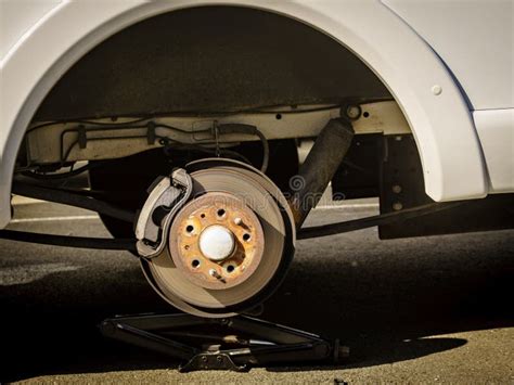 Car In Service Repairing Detail Of Wheel Assembly On Automobile Stock