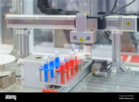 Automated System Designed For Handling Test Tubes In A Laboratory Setting Showcasing The