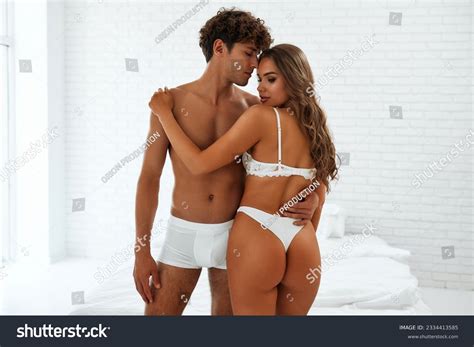 Photo De Stock Jeune Couple Sexy Amoureux En Lingerie 2334413585