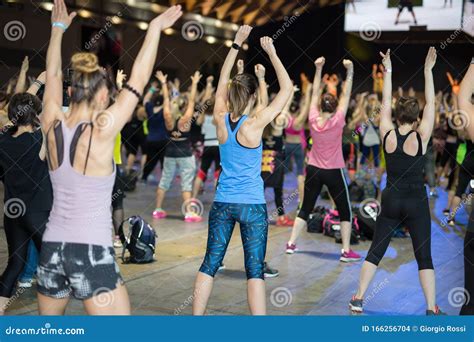 Fitness Workout In Gym People Doing Exercises In Class With Music And