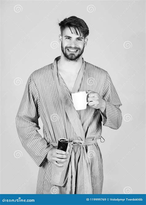 Relaxation And Leisure Drinking And Reading Happy Bearded Man Smiling