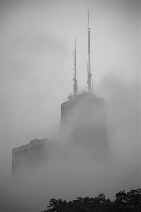 Hancock Tower Among The Clouds By Taylor Ehat Photography Wall Art