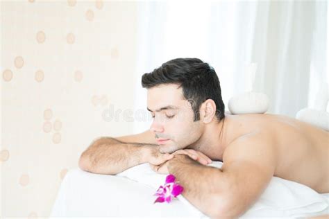 Male Massage Therapist Giving A Massage At A Spa Young Man In Spa