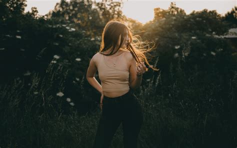 1440x900 Girl Illuminated By The Gentle Rays Of Sunlight Wallpaper