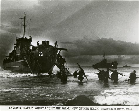 Us Servicemen Debarking From Uss Lcil 30 Onto A Beach Sarmi 1944