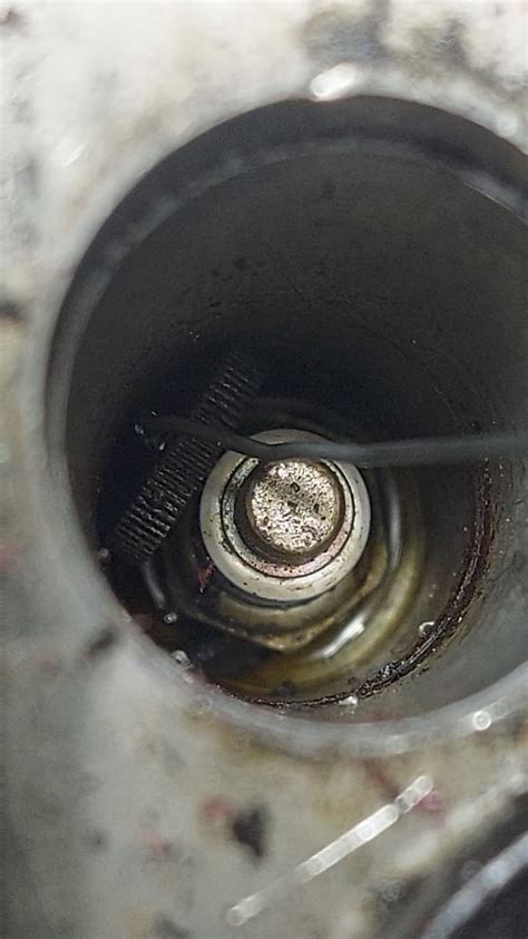 Using A Paperclip And Phone Camera To Remove A Piece Of Metal From A Blind Spark Plug Hole On