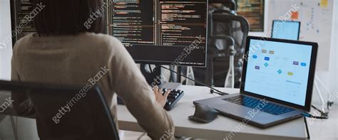 Young Adult Asian Male Female Software Developer Coding Program On