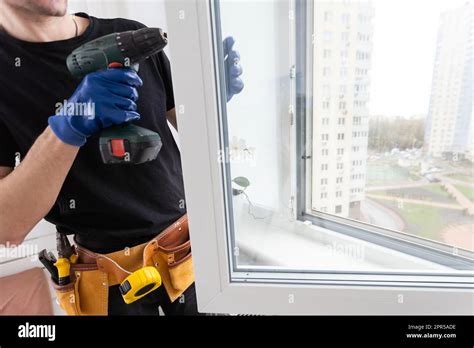 Worker Adjusting Installed Window With Screwdriver Indoors Closeup