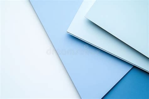 Elegant Composition Features Overlapping Geometric Panels In Muted Light Blue Shades Set Against