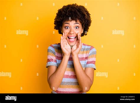 Photo Of Beautiful Dark Skin Curly Model Lady Holding Hands Near Mouth Spreading Rumours
