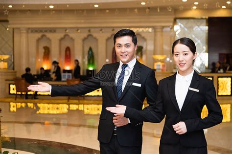 พนักงานจัดการโรงแรมท่าทางต้อนรับ Hd ภาพถ่ายสิ่งบันเทิง การจัดการ
