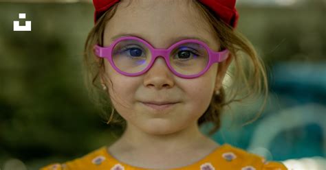 A Girl Wearing Pink Glasses Photo Free Acheron Image On Unsplash