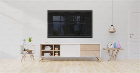 녹색 식물 램프 캐비닛이 있는 캐비닛에 Tv가 있는 거실 내부에는 흰색 벽 배경이 있습니다 3d 렌더링 사진 Unsplash의 가로 이미지