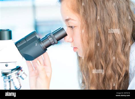 MODEL RELEASED Girl Using Microscope Close Up Stock Photo Alamy