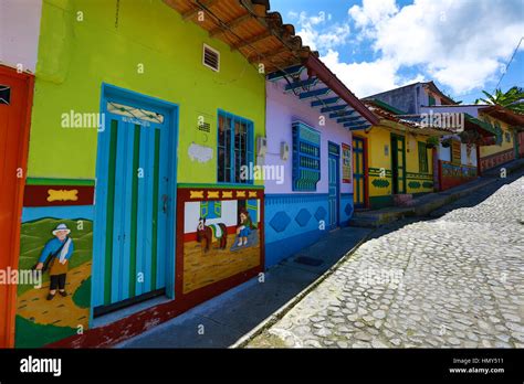 Colorful Colonial Houses And Cobblestone Street In Guatape Colombia