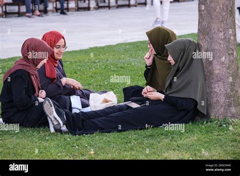 Istanbul Turkey Turkiye Turkish Muslim Girls Relaxing On The Lawn Of The Mosque Of Suleyman