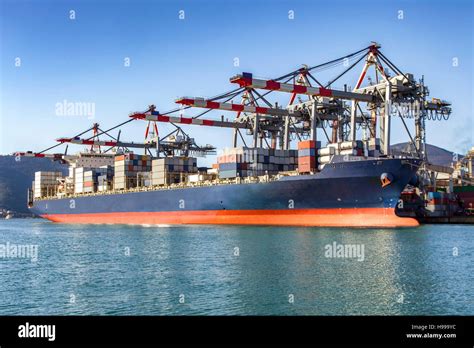 Loading Cargo Ship In Port Stock Photo Alamy