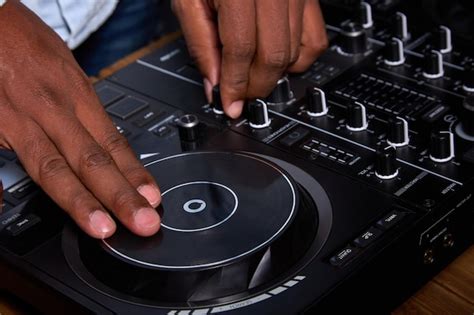 Premium Photo A Dj Console Or Mixer Is Used To Combine Different