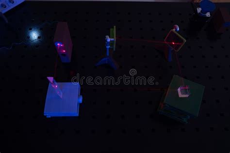 Experiment In Optic Lab With Laser Device Red Laser On Optical Table In Physics Laboratory