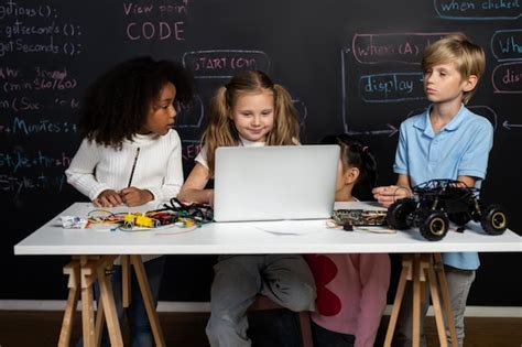 Premium Photo Smart Girl In White Bib Learning Robotics Technology Using Laptop Erudition