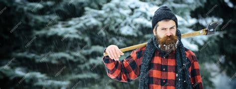 Premium Photo Hipster With Beard On Serious Face With Axe Lumberjack Brutal Bearded Man Holds